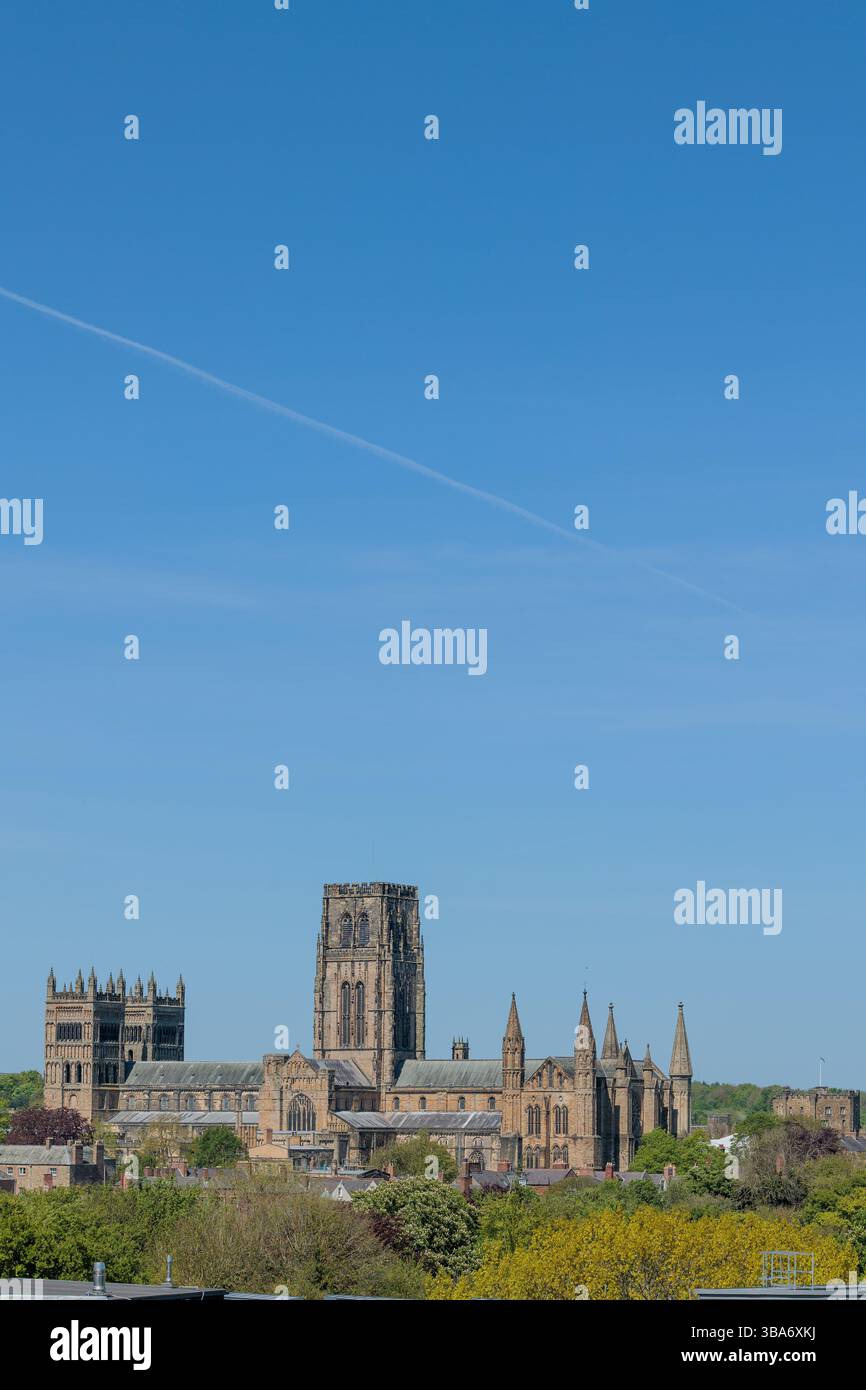 Durham Cathedral and Castle stands tall against a clear blue sky, a ...