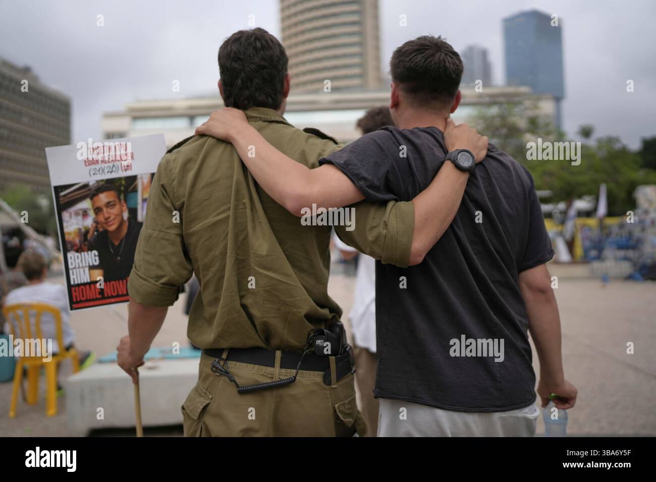 Israelis gather to watch a live broadcast of Israeli-American soldier ...