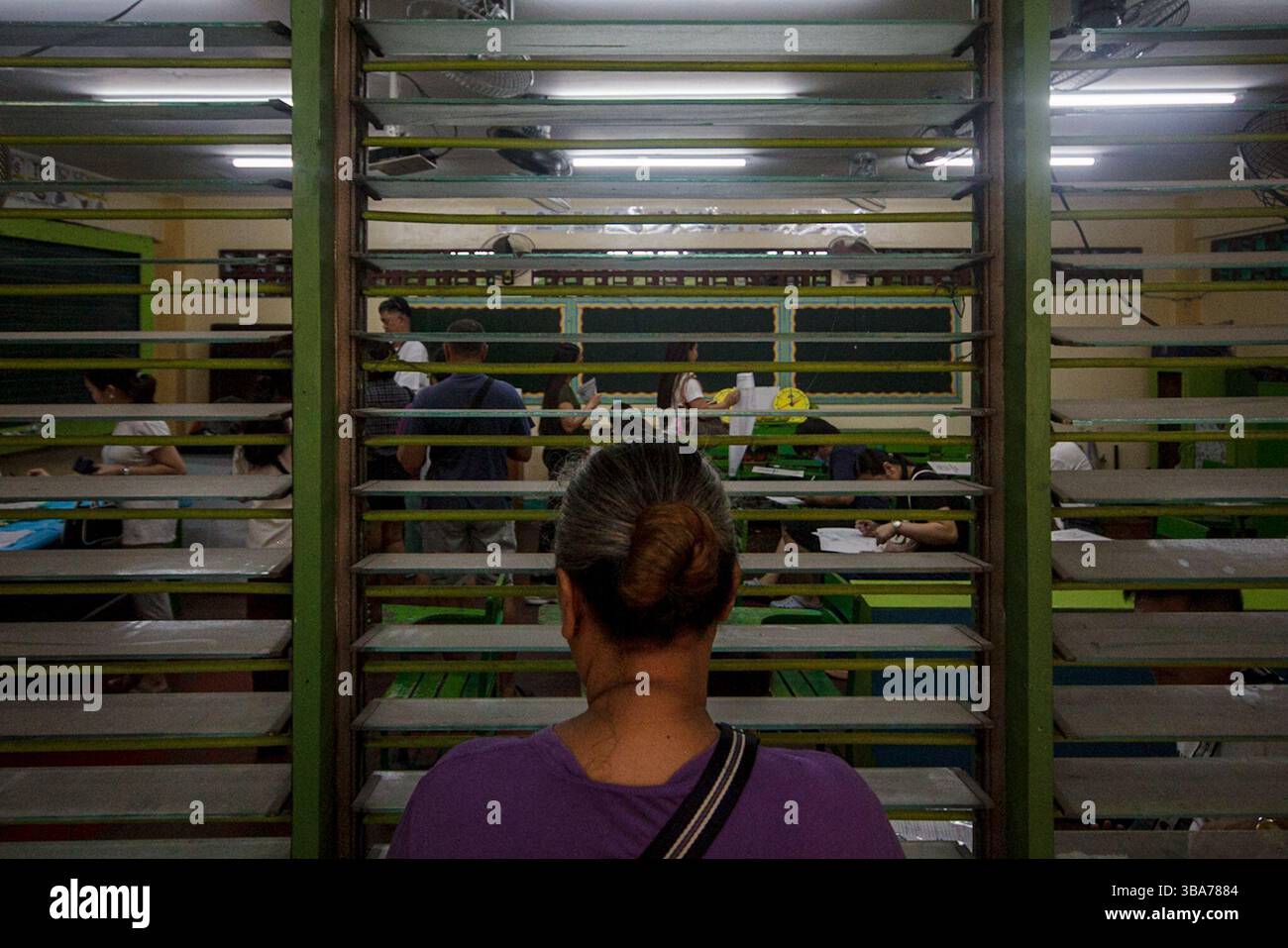 Manila, Ncr, Phillippines. 12th May, 2025. A poll watcher looks over ...