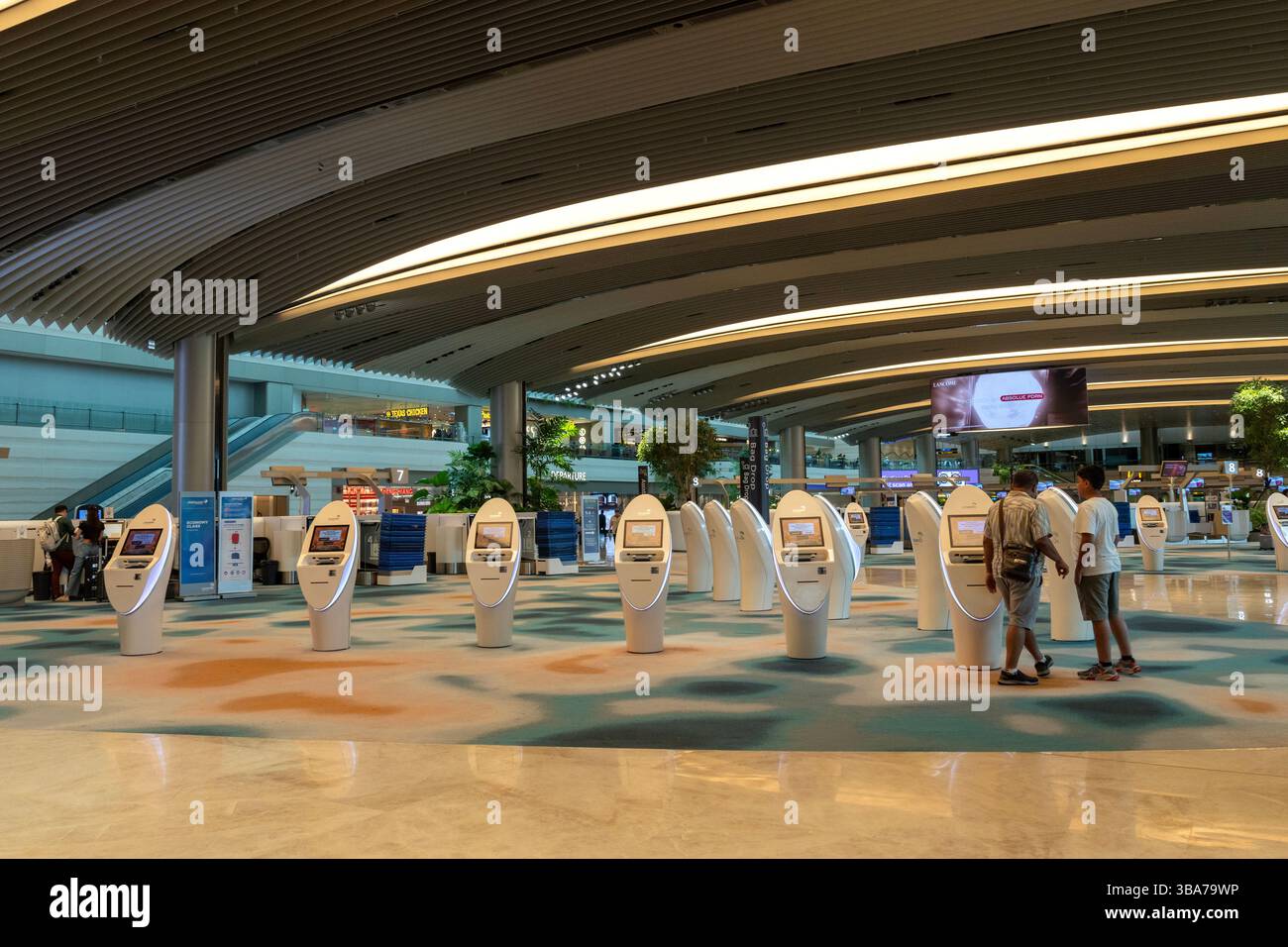 Singapore- 8 April, 2025: Self check-in kiosks at the Changi Airport ...