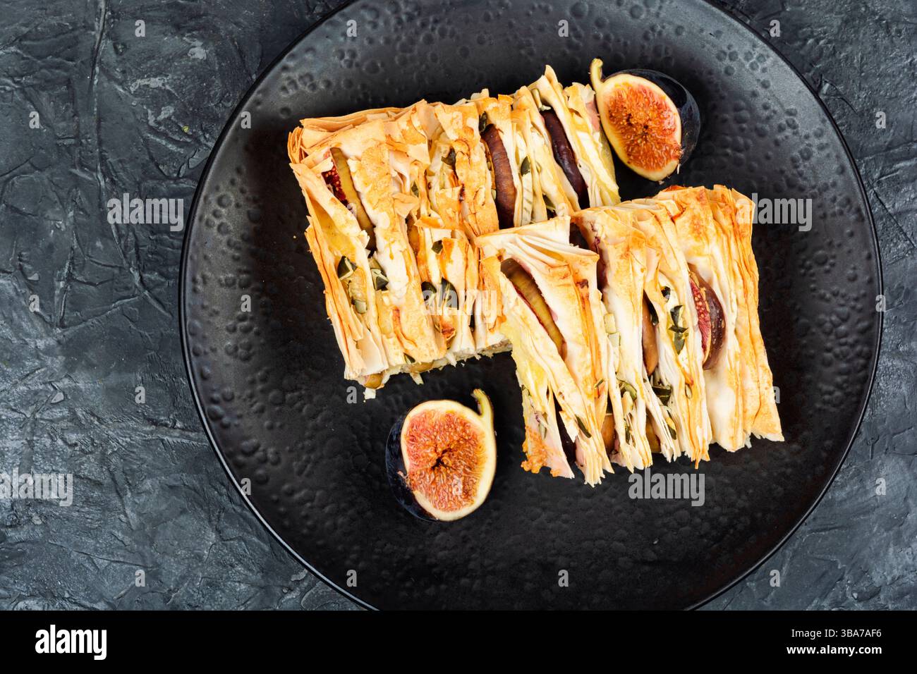Homemade filo pastry pie with ripe figs and brie cheese Stock Photo - Alamy