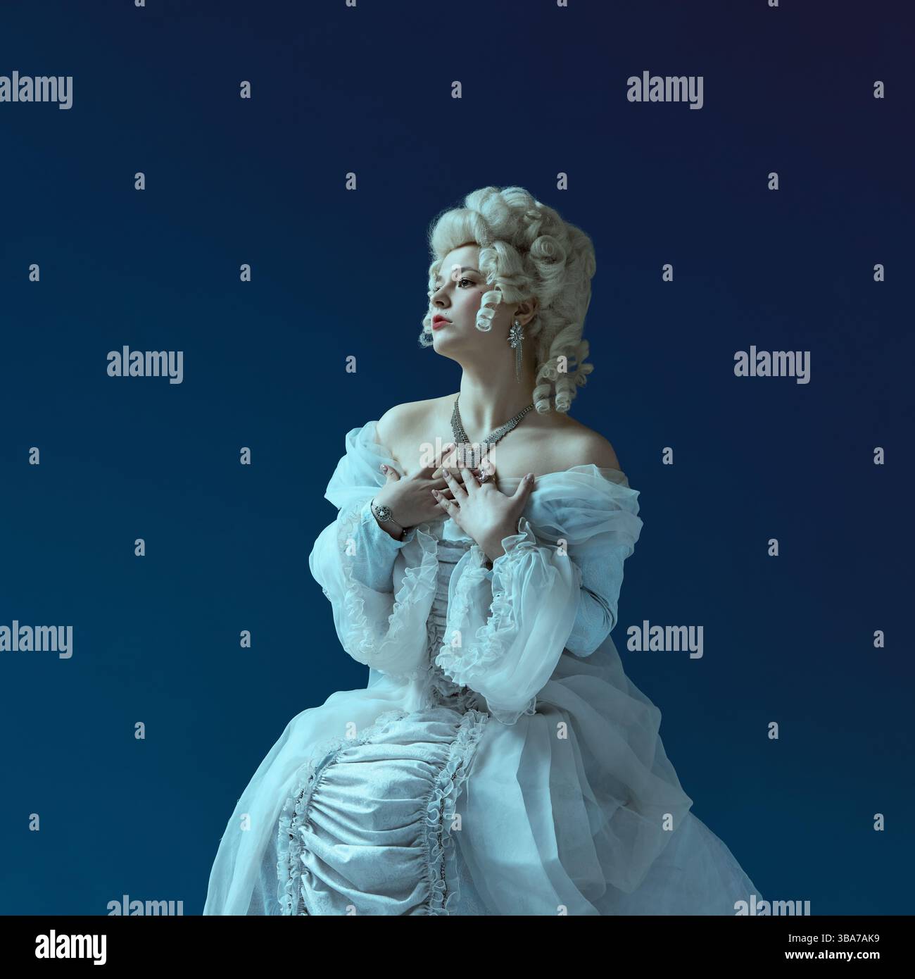 Dramatic silence. Noblewoman in powdered wig and vintage blue gown ...