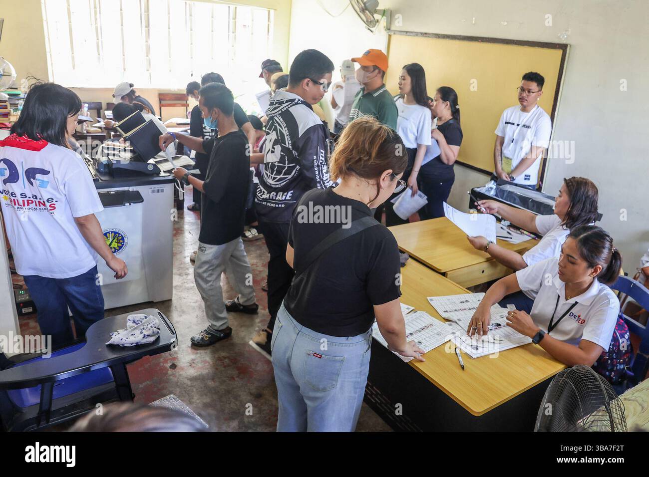 Quezon City, Philippines. 12th May, 2025. People cast their ballots at ...