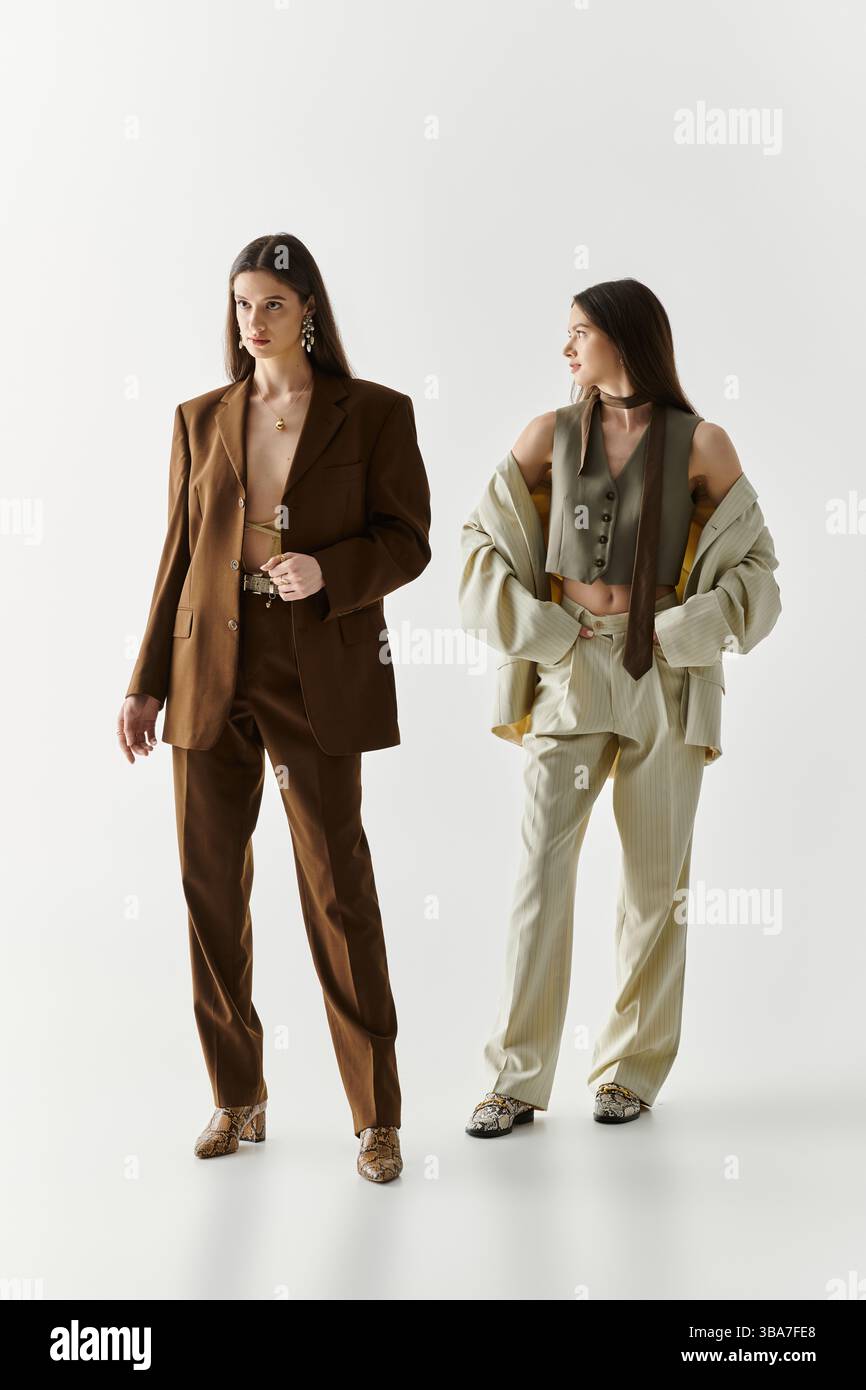 Two beautiful twin sisters display distinct outfits while celebrating ...