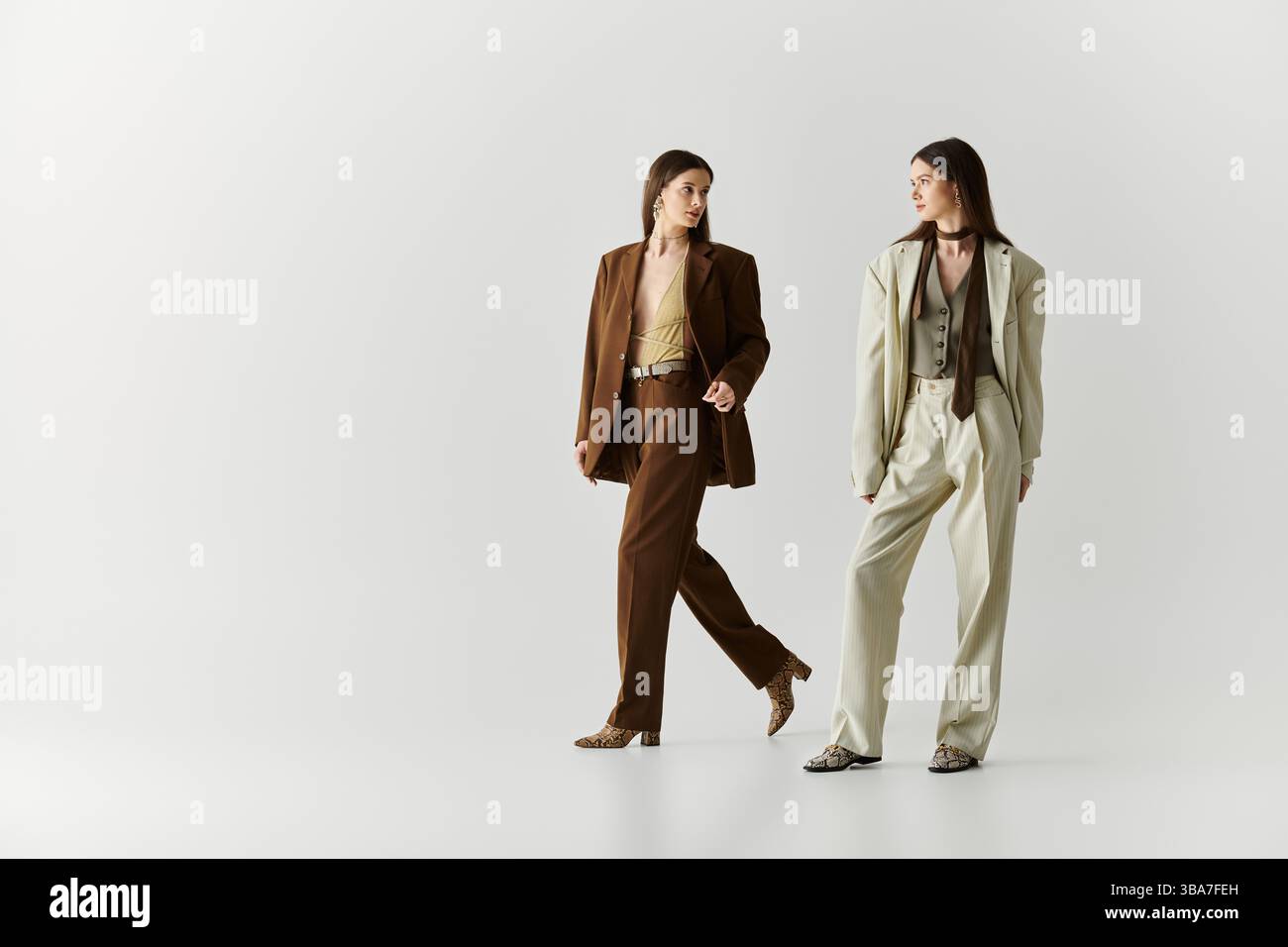 Two elegant twin sisters express their distinct styles while ...