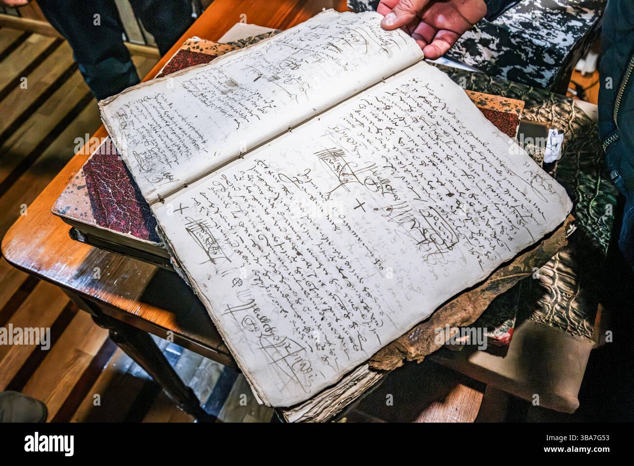 Examining a Fragile Handwritten Historical Document in the Archive of ...