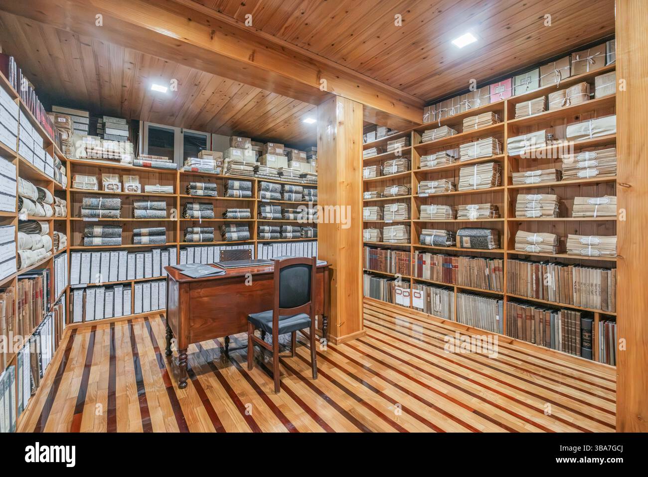 Historic Archive Room with Wooden Shelves Full of Documents and Registers. Organized Records in ...
