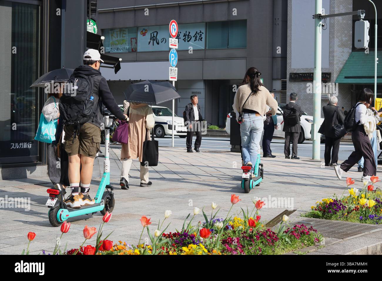 TOKYO, JAPAN - April 17, 2025: Sidewalk in Tokyo's Nihonbashi area with ...