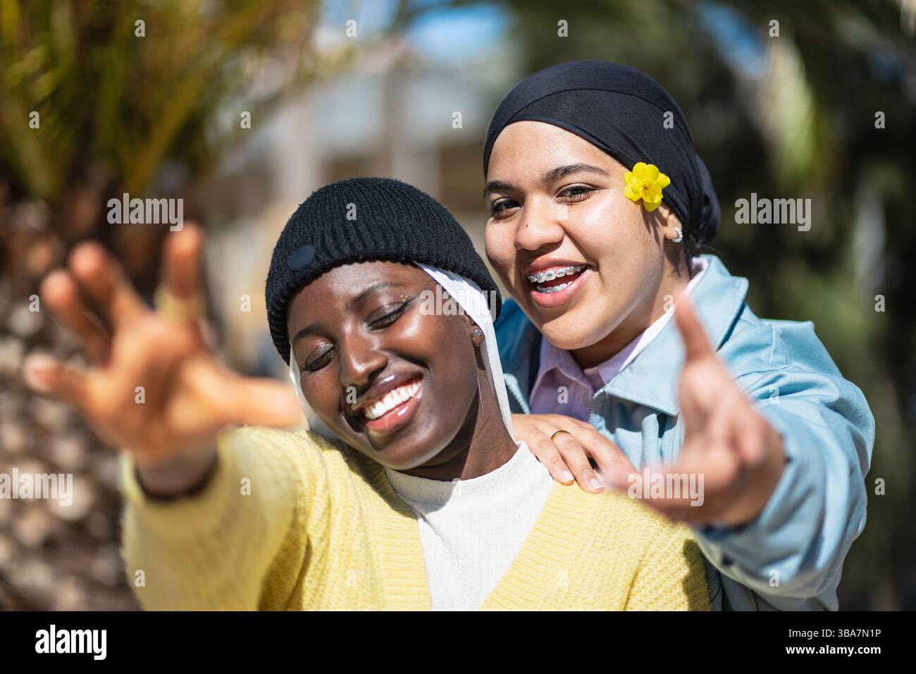 Teenager gen z muslim friends having fun in sunny spring day Stock ...