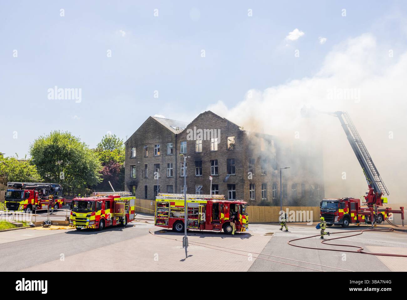 Bradford, UK. 12 MAY, 2025. Fire continues to burn at abandoned ...