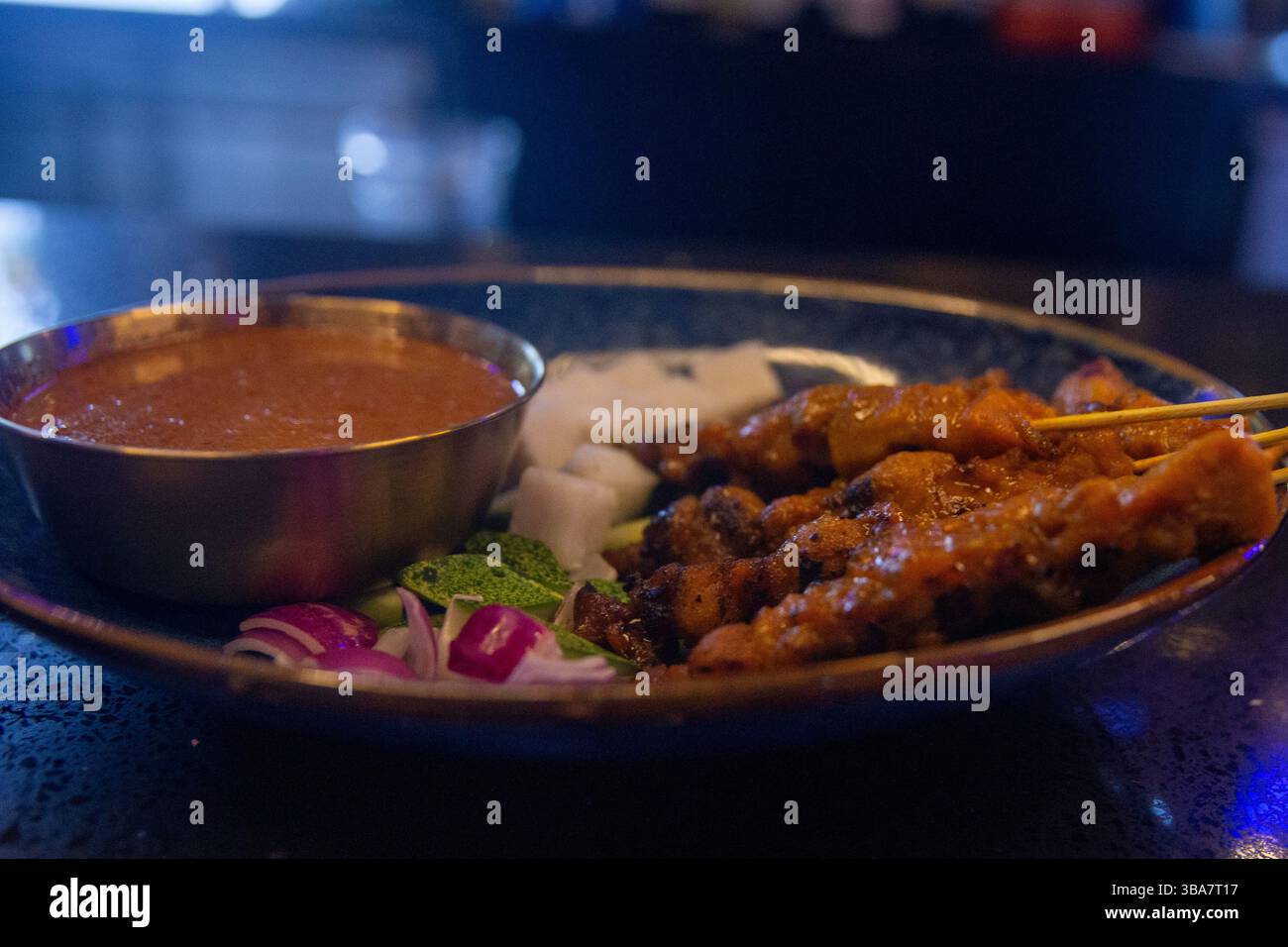Malaysian style chicken satay with it's condiments Stock Photo - Alamy