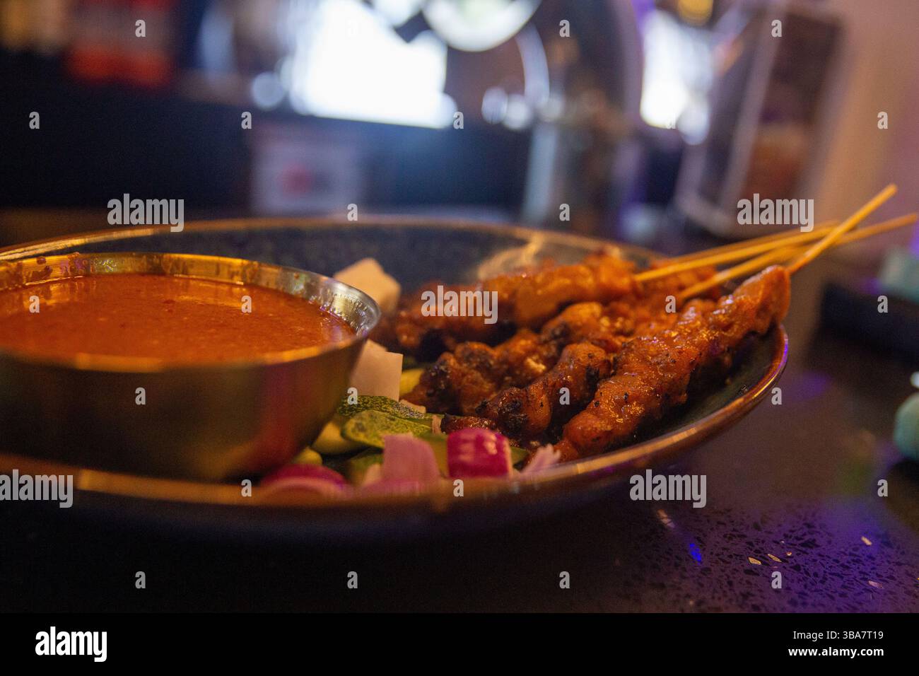Malaysian style chicken satay with it's condiments Stock Photo - Alamy