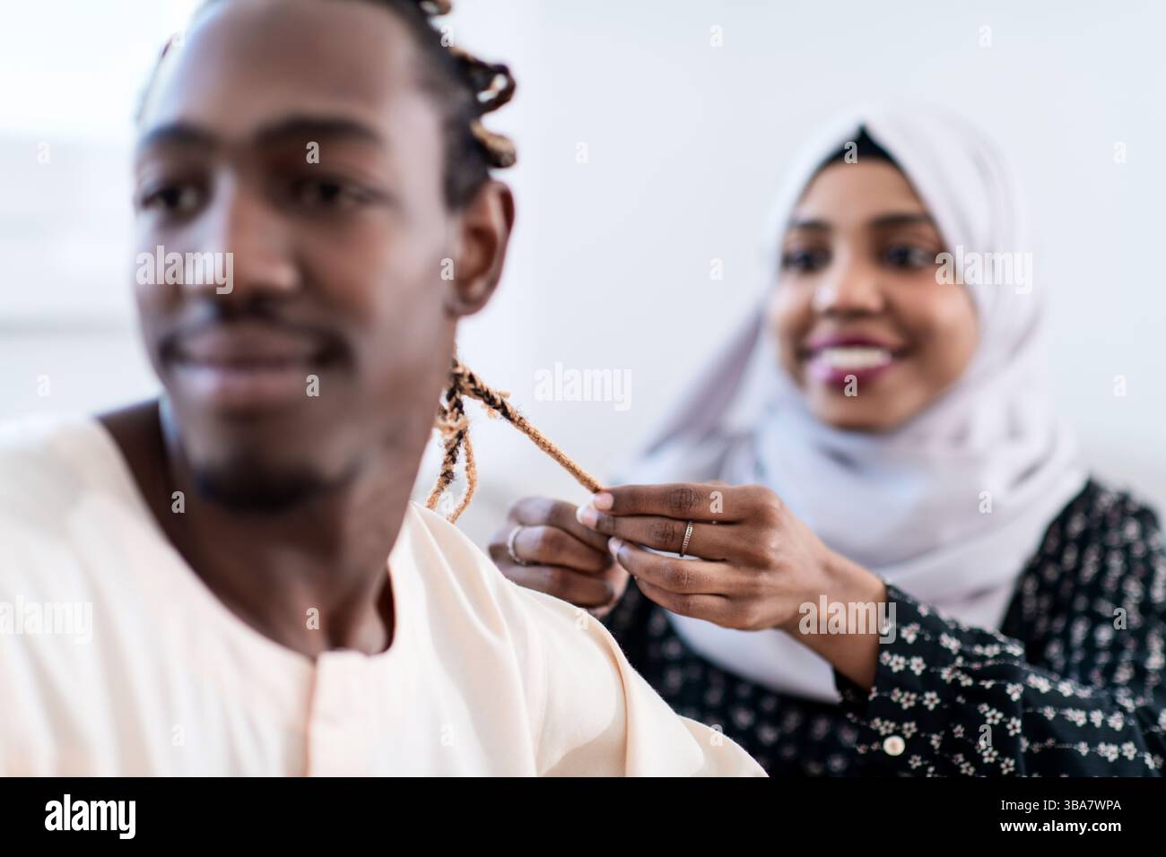 young afro modern muslim couple having romantic time at home while ...