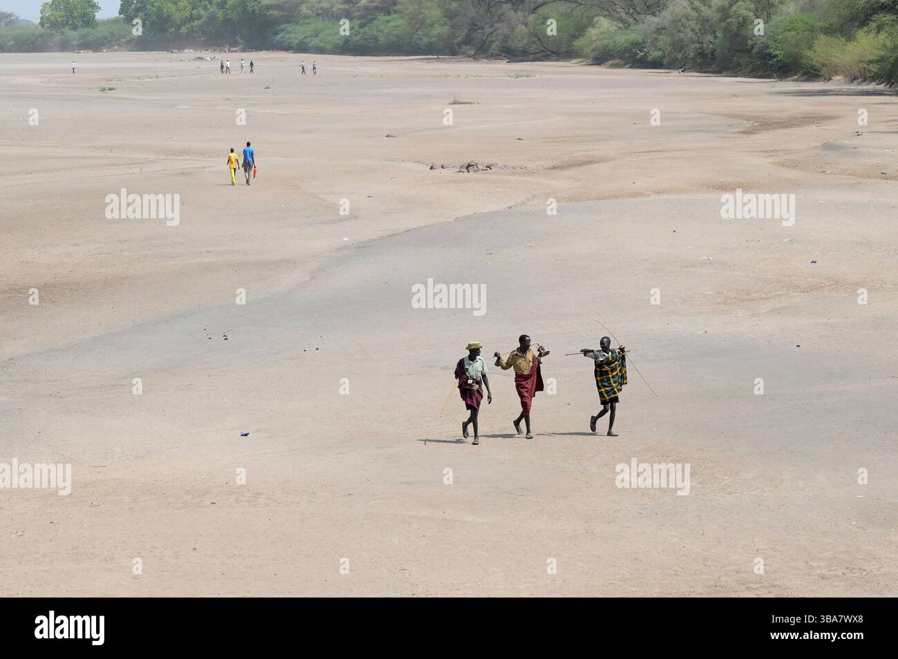 KENYA, Turkana, Kakuma, Turkana tribe men in empty Tarach river bed ...