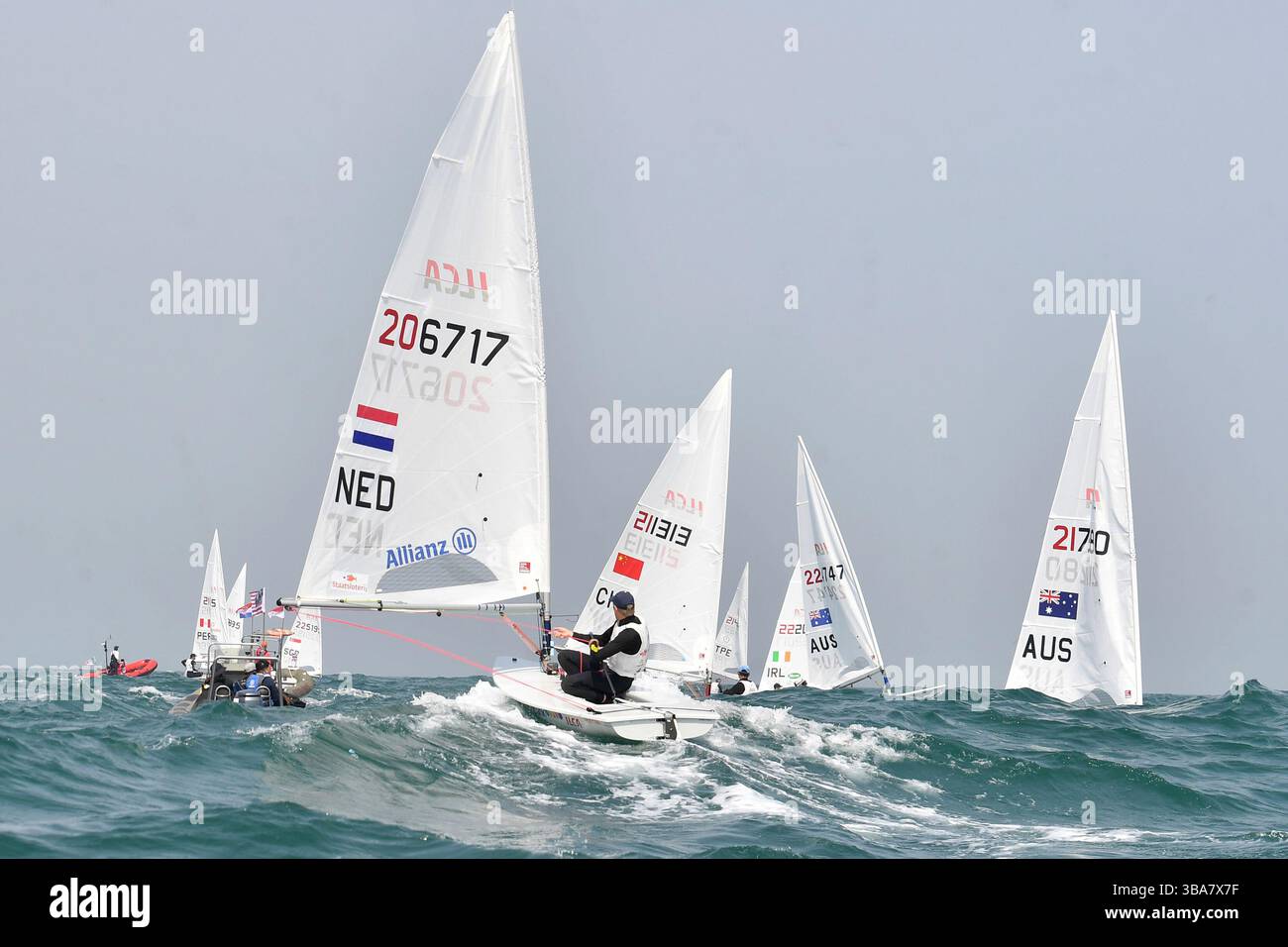 Sails set off during a competition of the ILCA 6 Women's and ILCA 7 Men ...