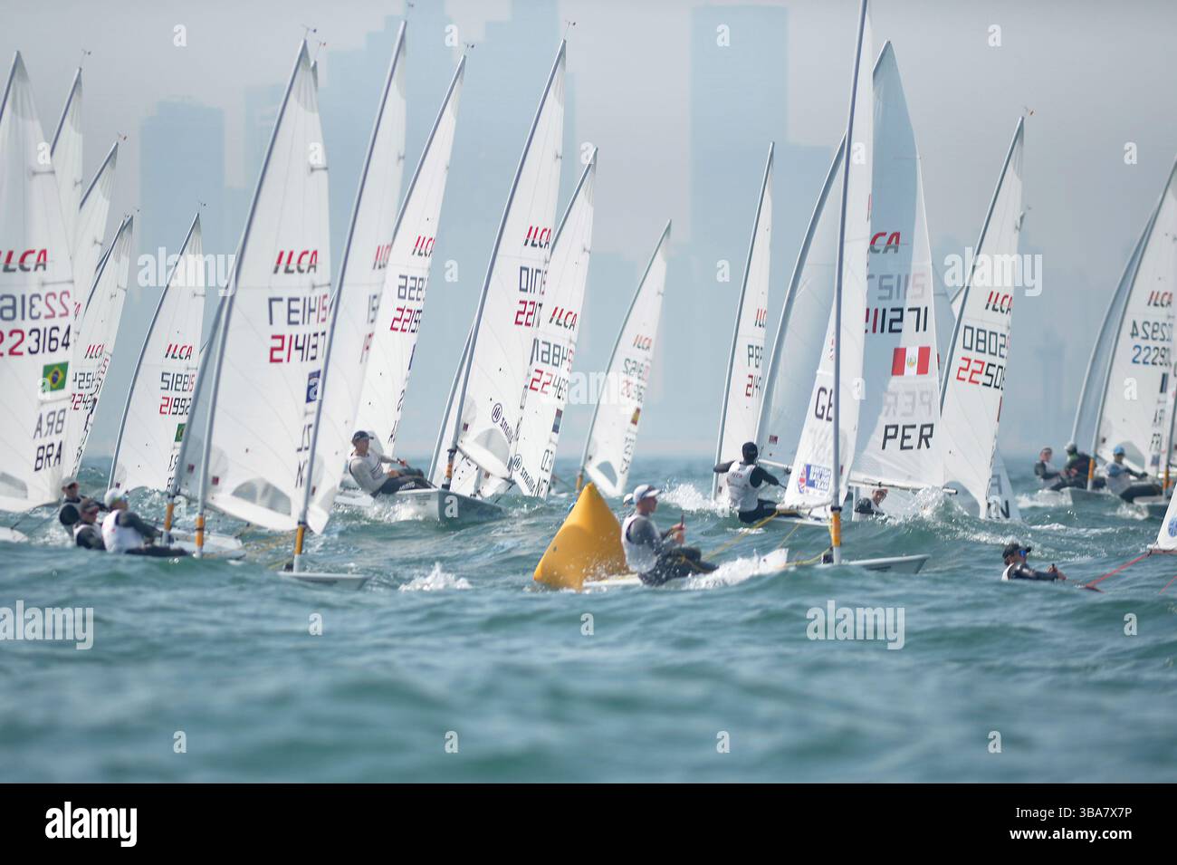 Sails set off during a competition of the ILCA 6 Women's and ILCA 7 Men ...