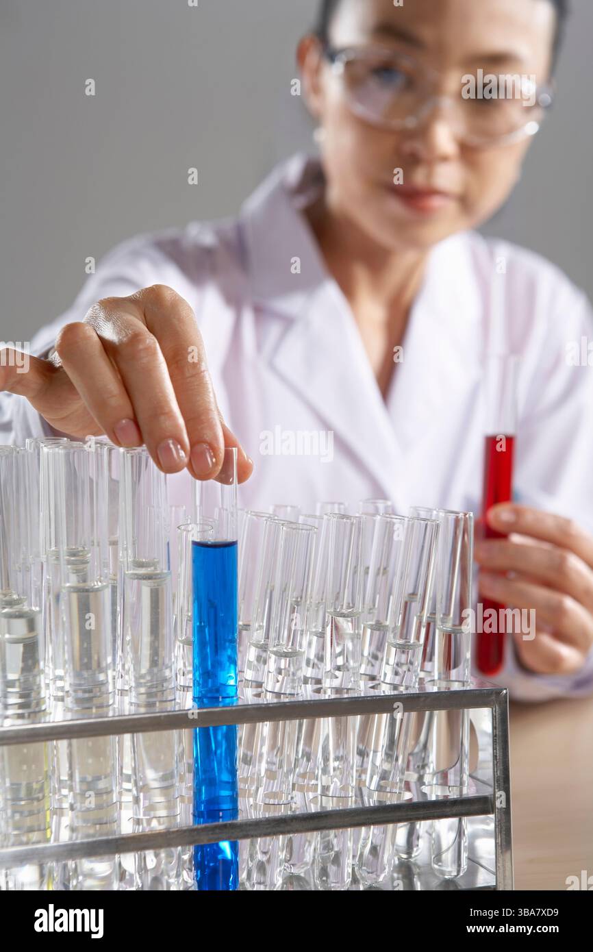 Chinese scientists with test tubes Stock Photo - Alamy