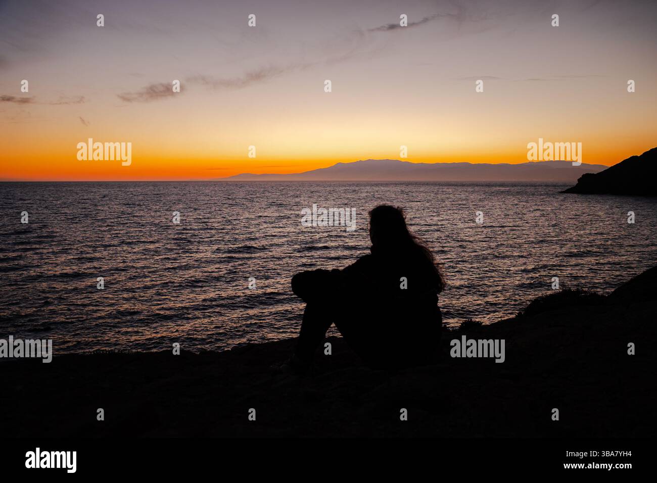 Silhouette of Woman Watching Ocean Sunset in Cabo de Gata, Almeria ...