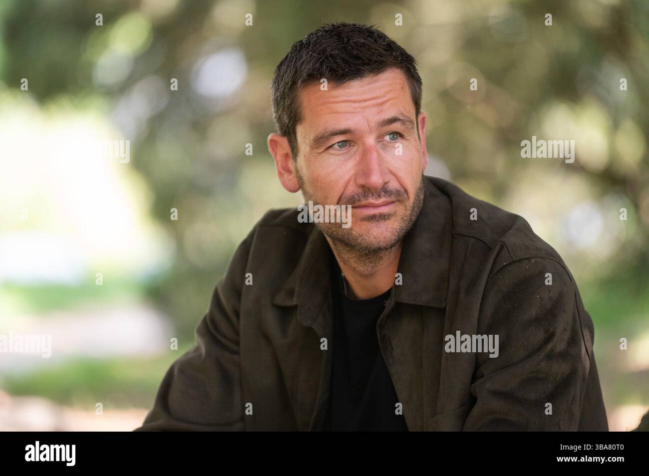 Berlin, Germany. 12th May, 2025. Michael Epp, actor, sits in a park on ...