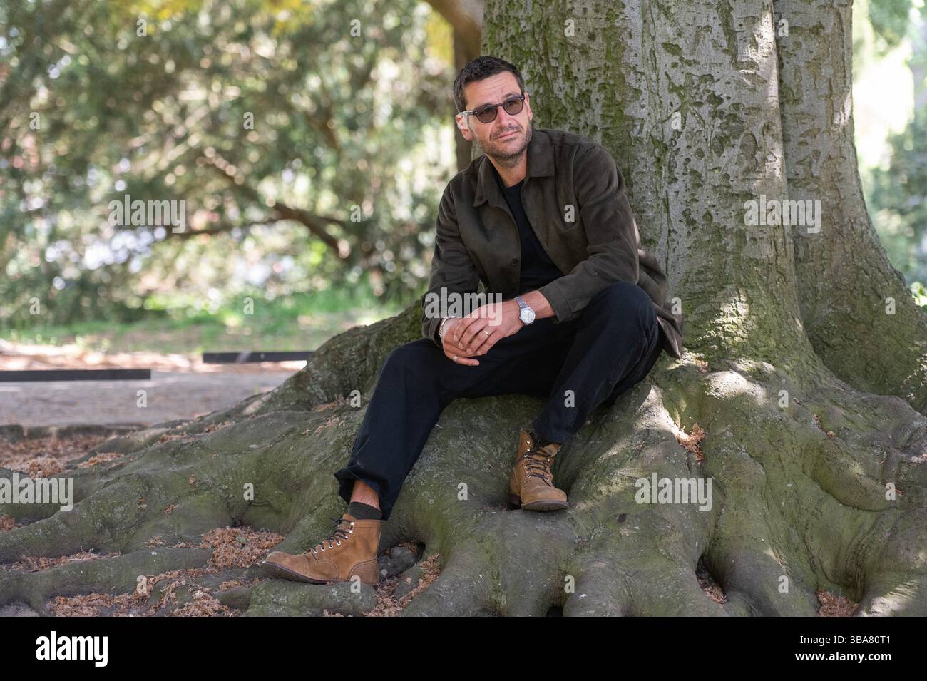 Berlin, Germany. 12th May, 2025. Michael Epp, actor, sits in a park on ...