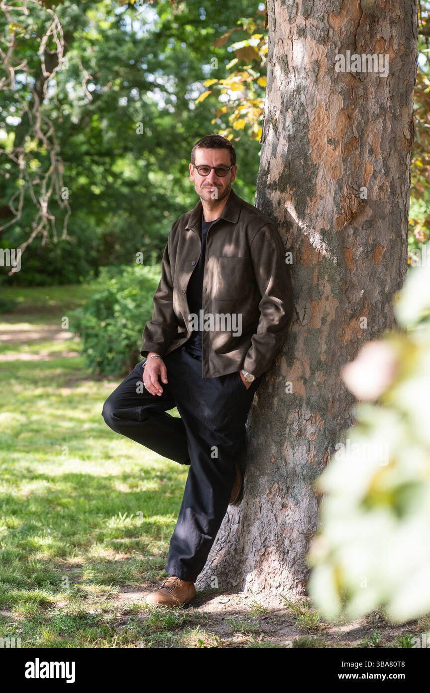 Berlin, Germany. 12th May, 2025. Michael Epp, actor, stands in a park ...