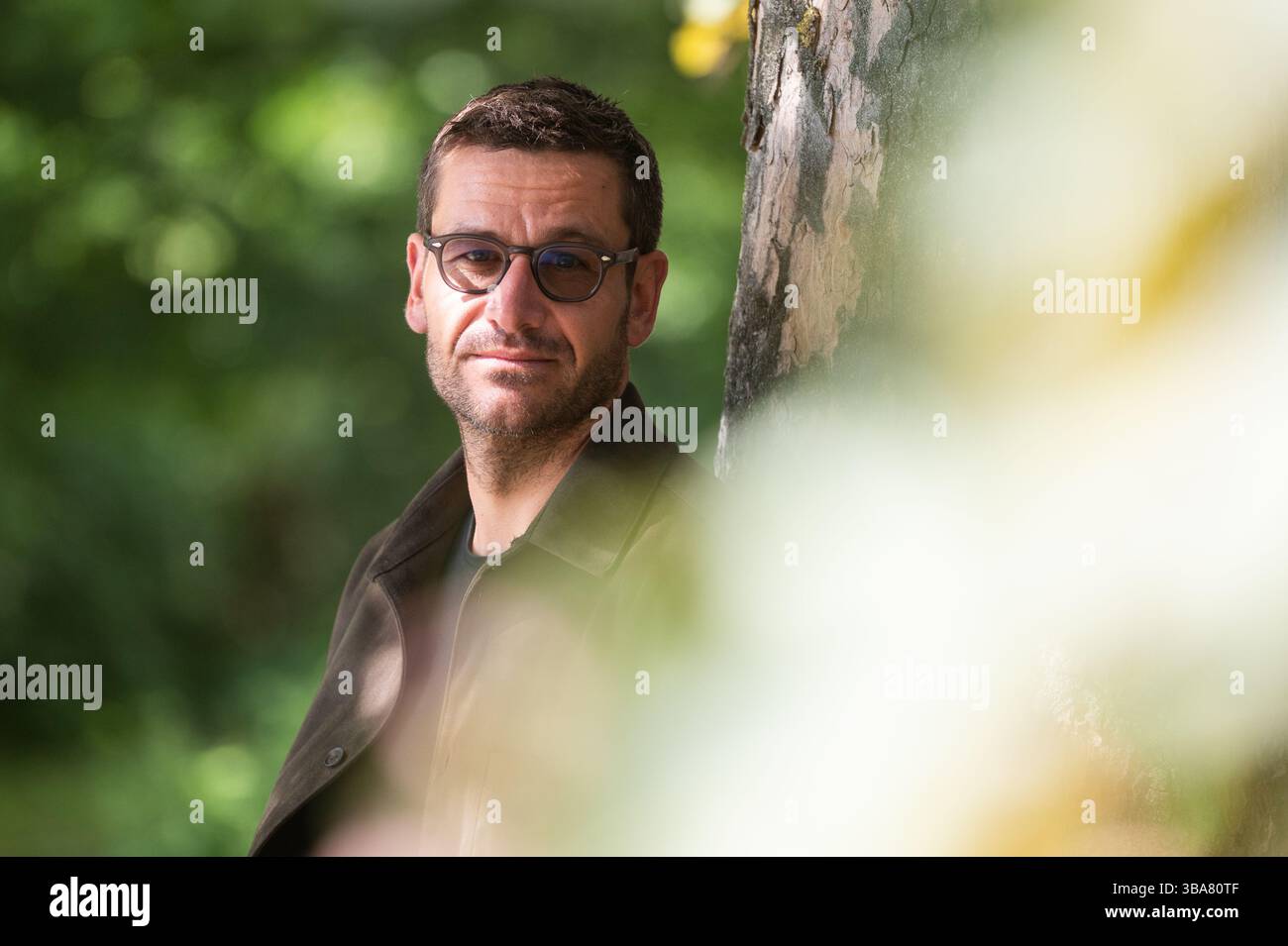 Berlin, Germany. 12th May, 2025. Michael Epp, actor, stands in a park ...