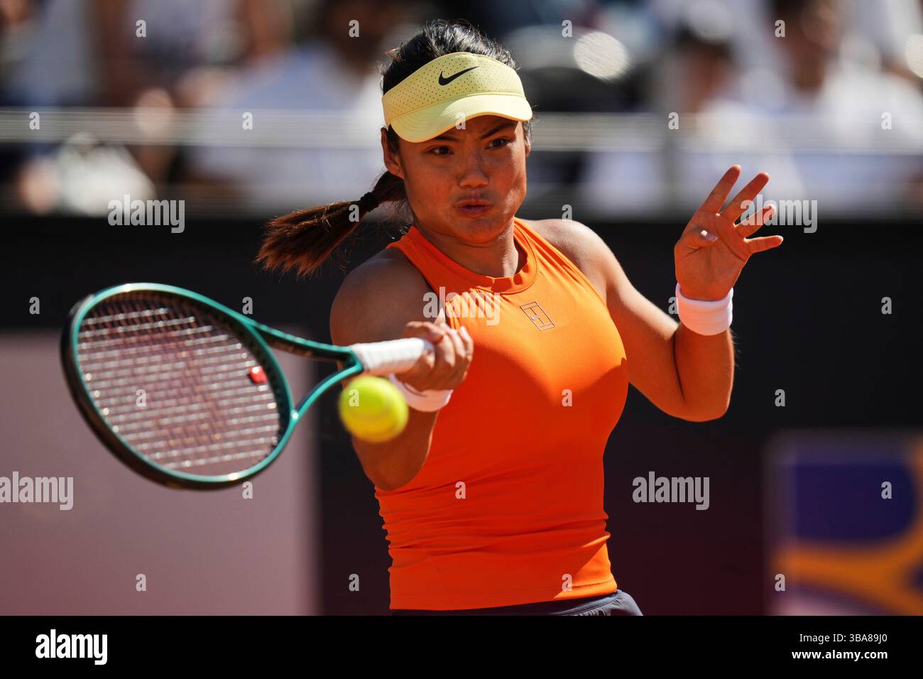 Britain's Emma Raducanu returns the ball to United States' Coco Gauff ...