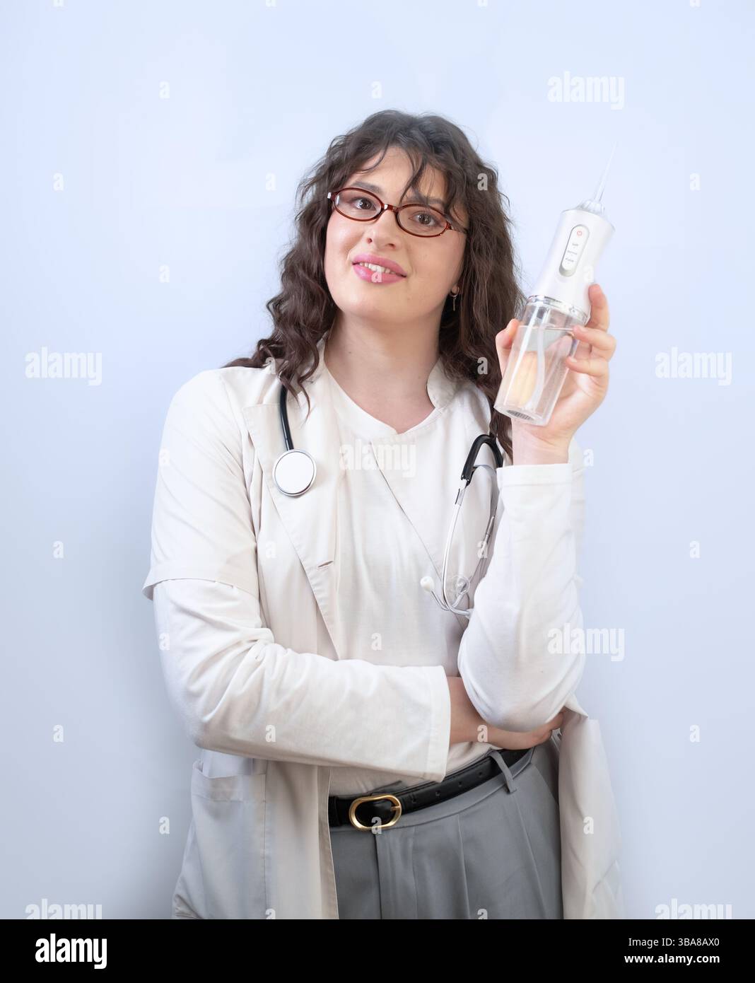 Electronic water flosser in dentist hands ensures deep tooth cleaning ...