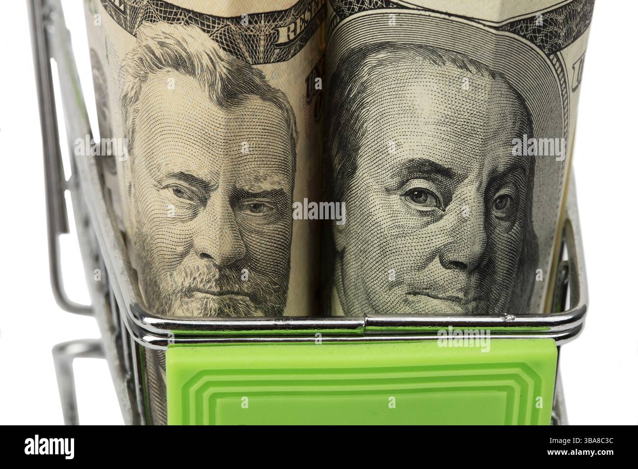 It is a dollar in a metal grocery basket shopping cart with dollar bill ...