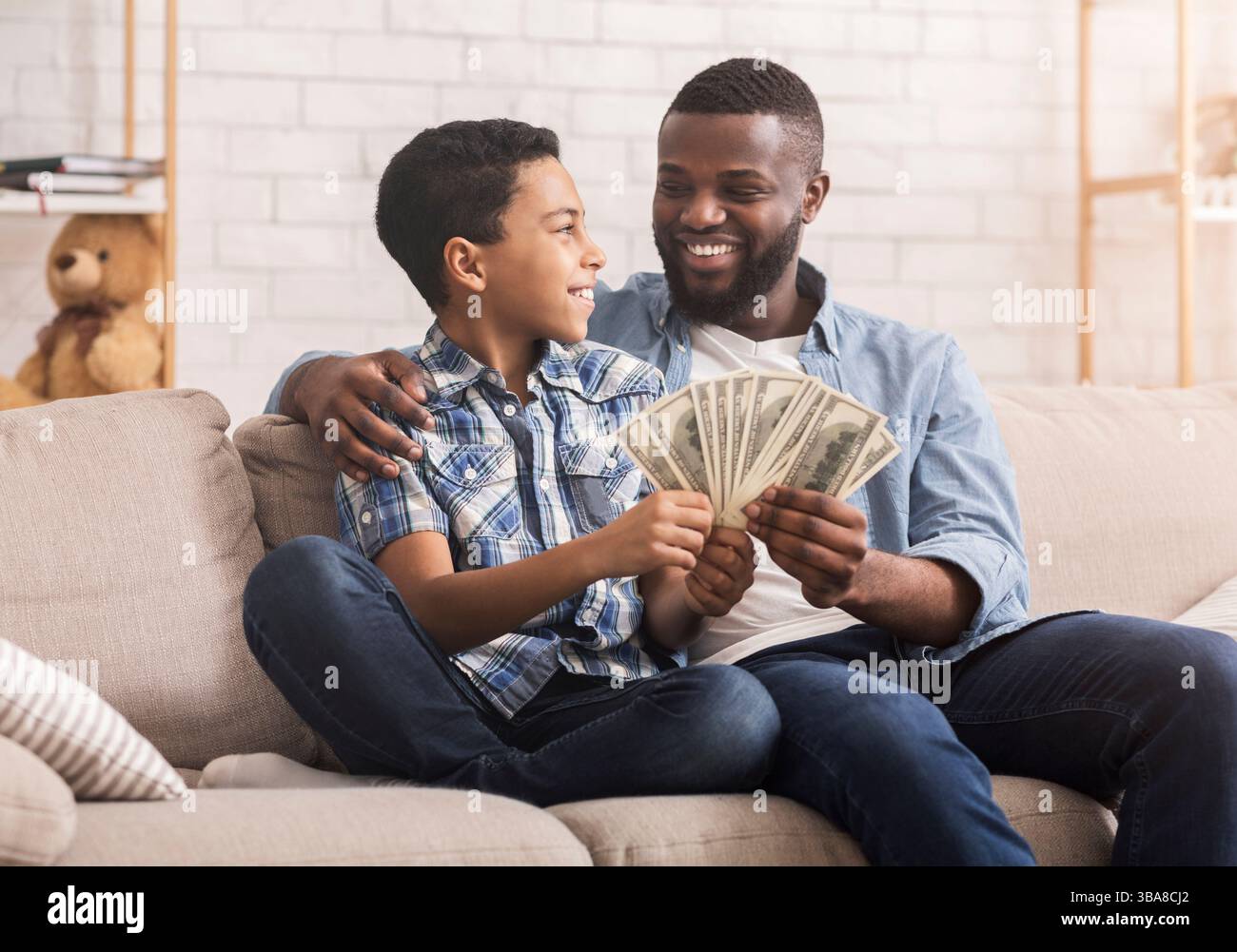 College Savings Plan Concept. Portrait Of Happy Afro Dad And His ...