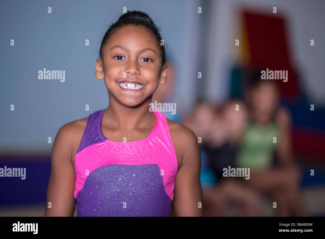 Portrait of young Latina girl gymnast smiling Stock Photo - Alamy