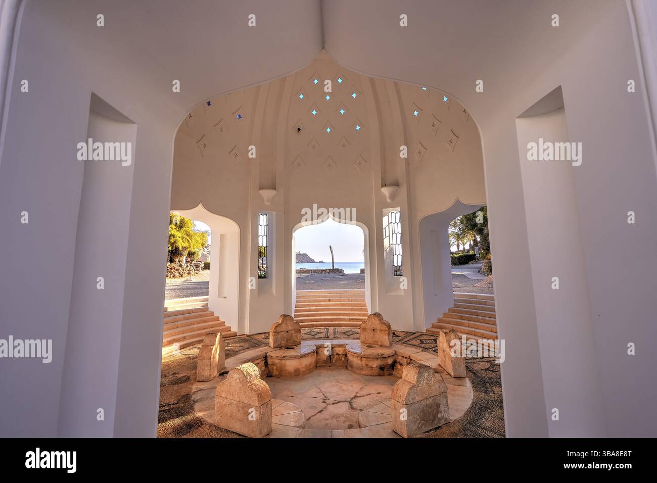 The interior of an architecturally designed structure features arches ...