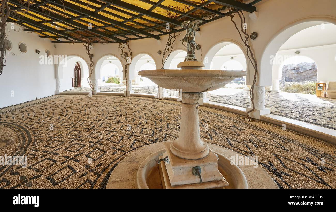 Open atrium with central fountain and detailed mosaic pattern in the ...