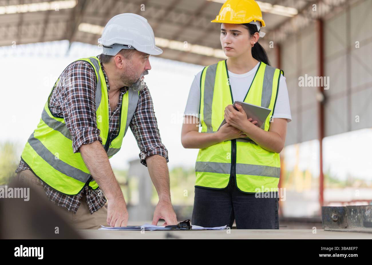 Site manager and builder inspect the construction site, Female foreman ...