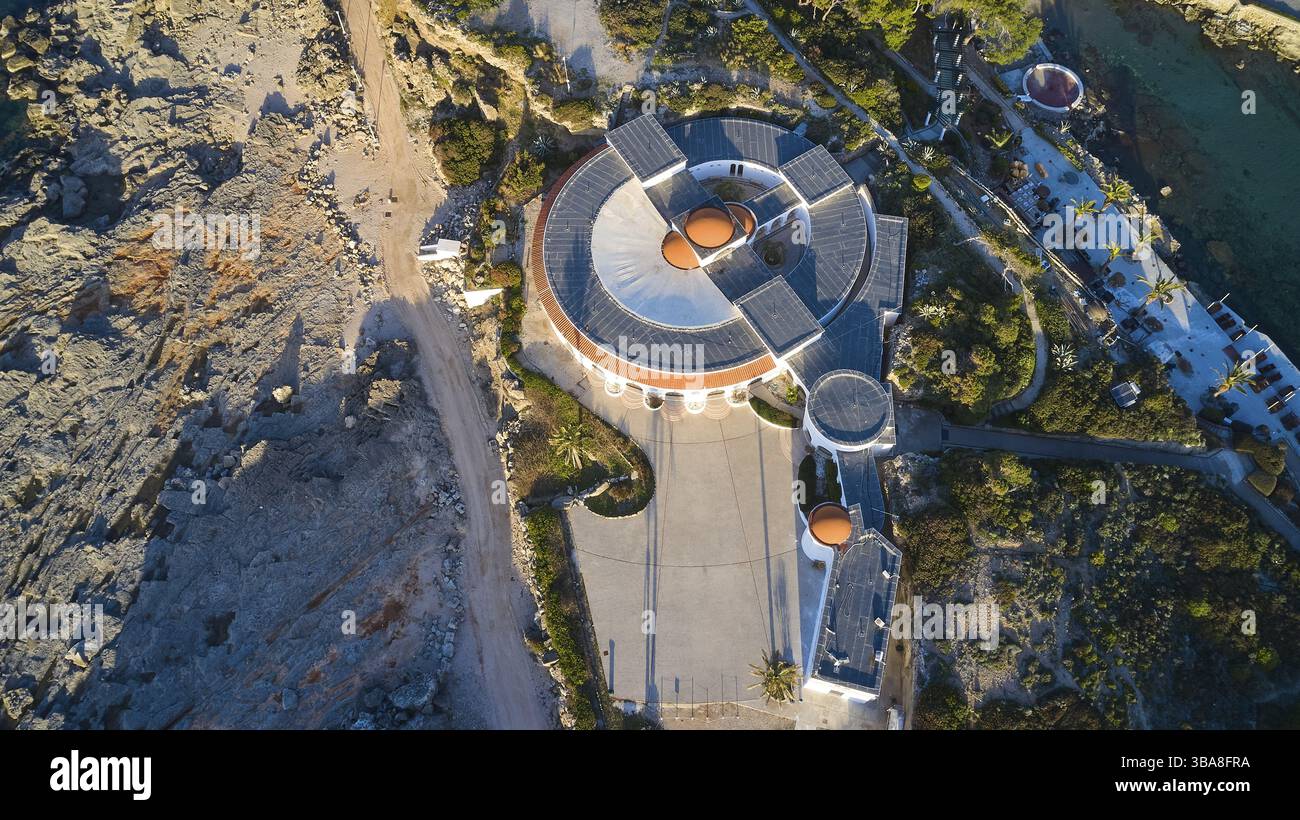 Drone shot, morning light, building with unique roof design, taken from ...