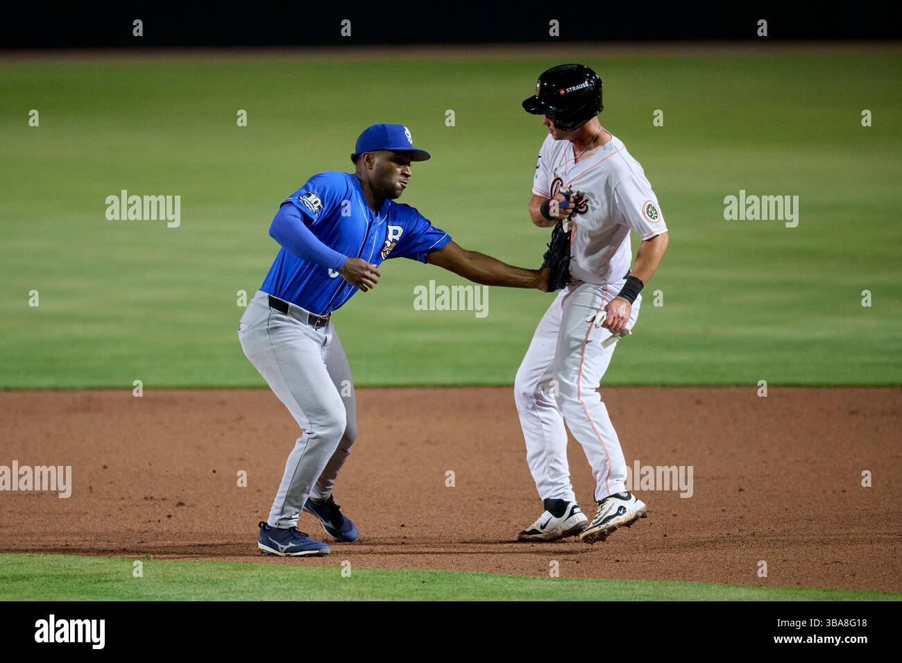 Biloxi Shuckers second baseman Zavier Warren (8) tags Cal Conley (13 ...