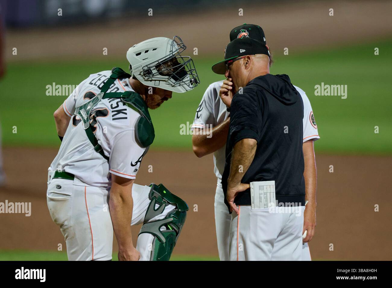 Columbus Clingstones pitching coach Mike Steed talks with catcher Adam ...
