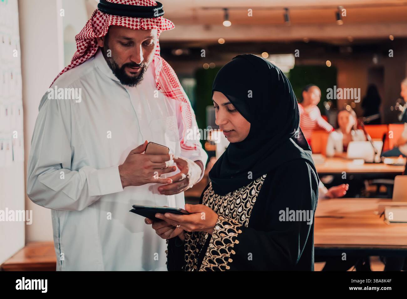 Portrait photo of Arab leader businessman with Muslim hijab woman ...