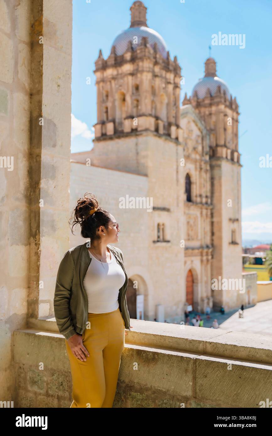 Hispanic female tourist admiring the architecture while standing on ...