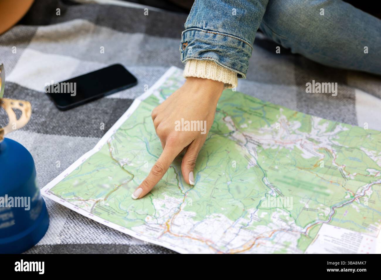 Needed place. Close up picture of a female hand poing to the map Stock ...