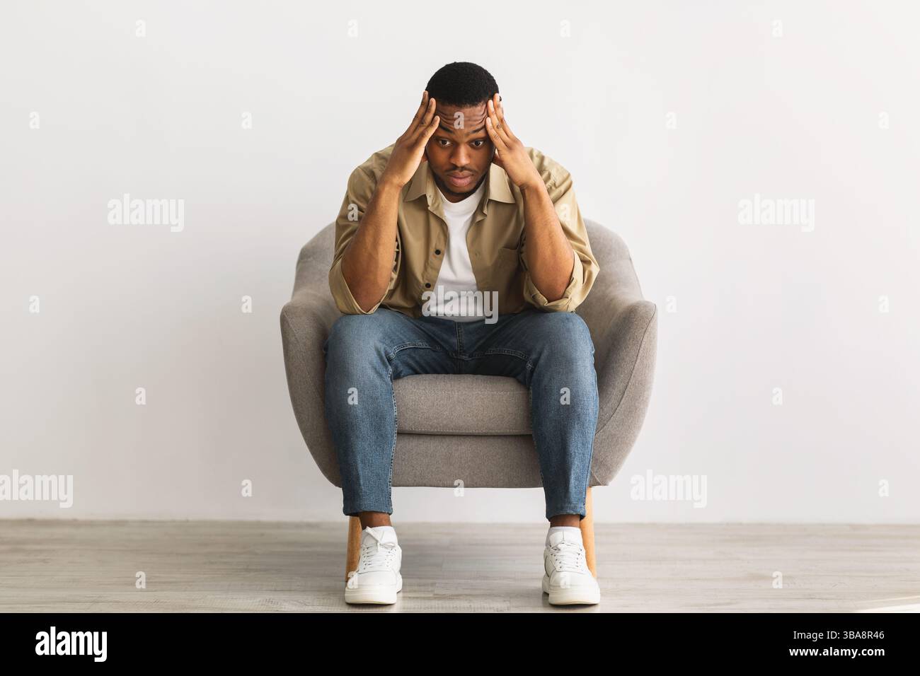 Concerned African American Guy Thinking And Worrying About Problems ...