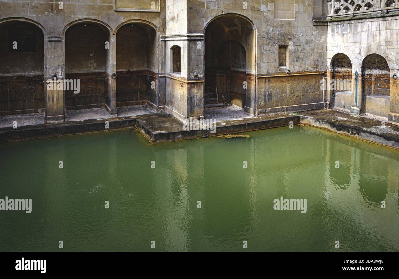 Water and buildings in an old roman bath in the city of Bath in the ...