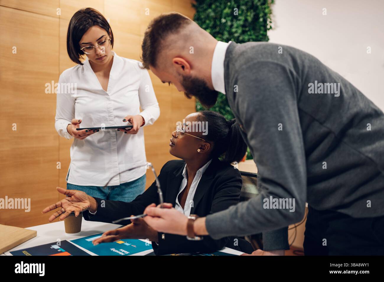 Team leader analyzing sales data statistics or explaining marketing ...