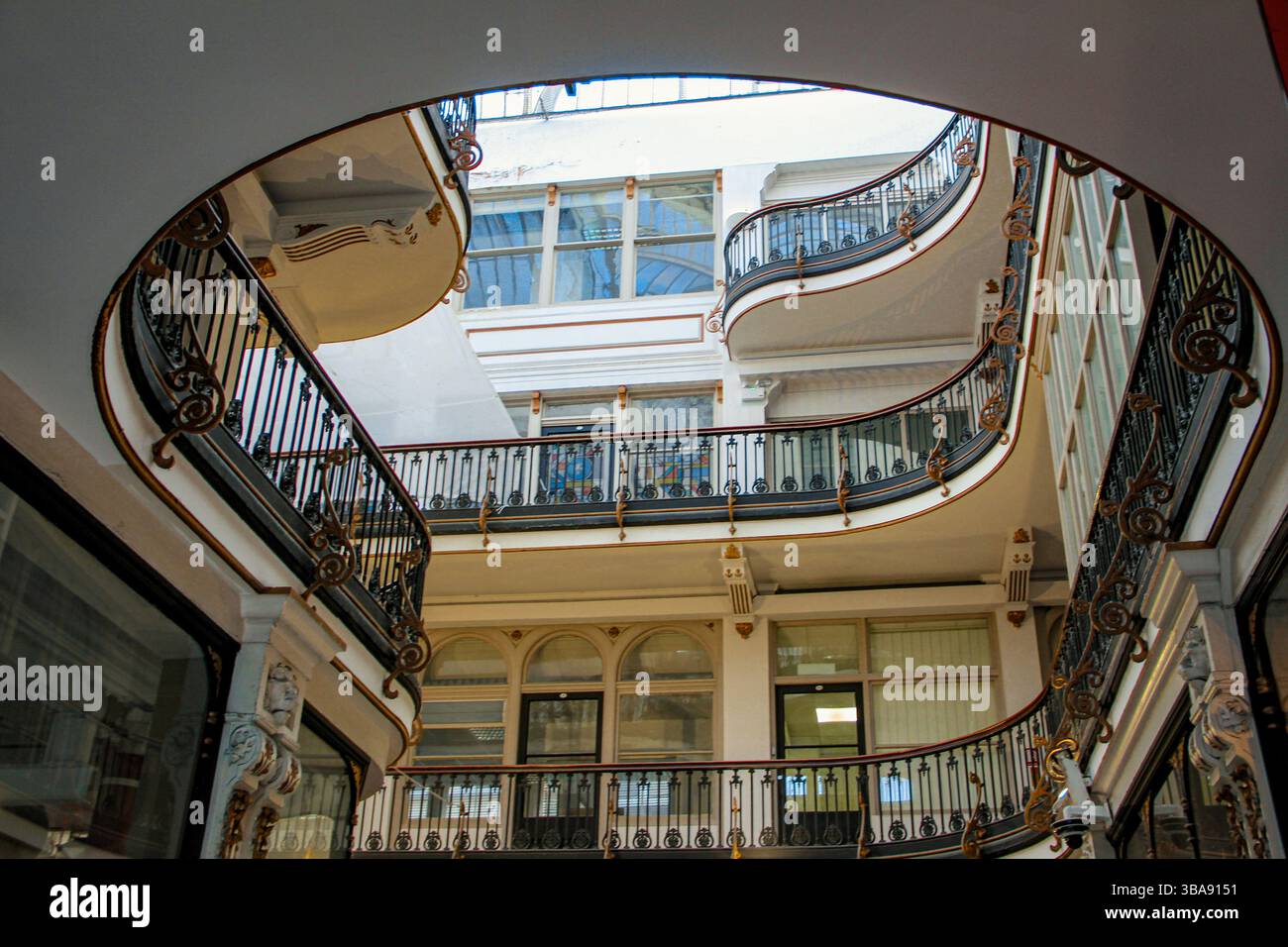 Interior of a Victorian-style Barton Arcade with iron railings and ...