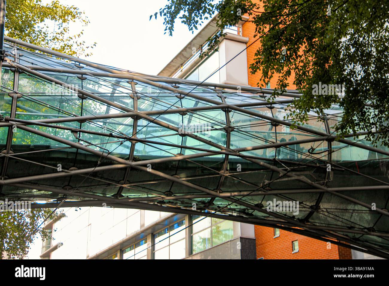 Corporation St: A pedestrian skywalk connecting two modern buildings ...