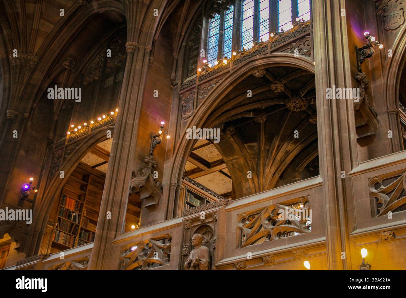 Intricately carved library interior with stained-glass windows and ...