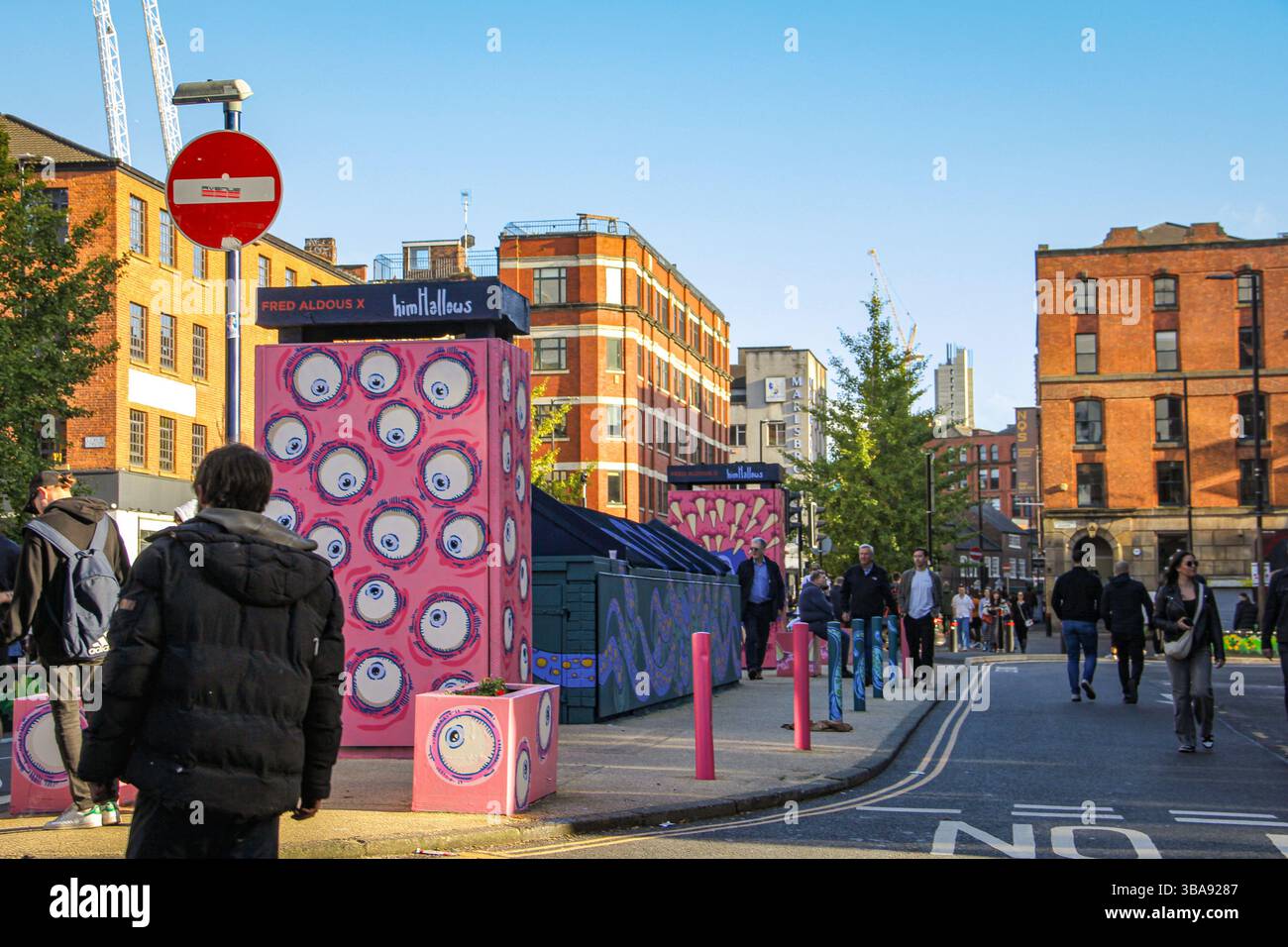 Stevenson Square, Urban pedestrian zone with street signs and art ...