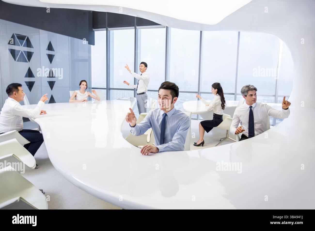 Chinese business people using advanced touch screen technology in ...