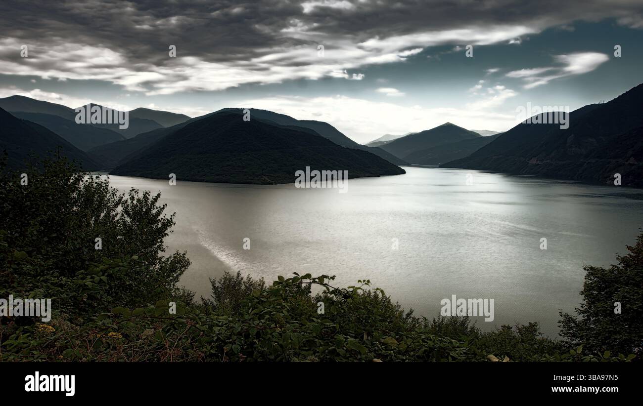 Evening dramatic mountain landscape, lake and mountain range, panorama ...