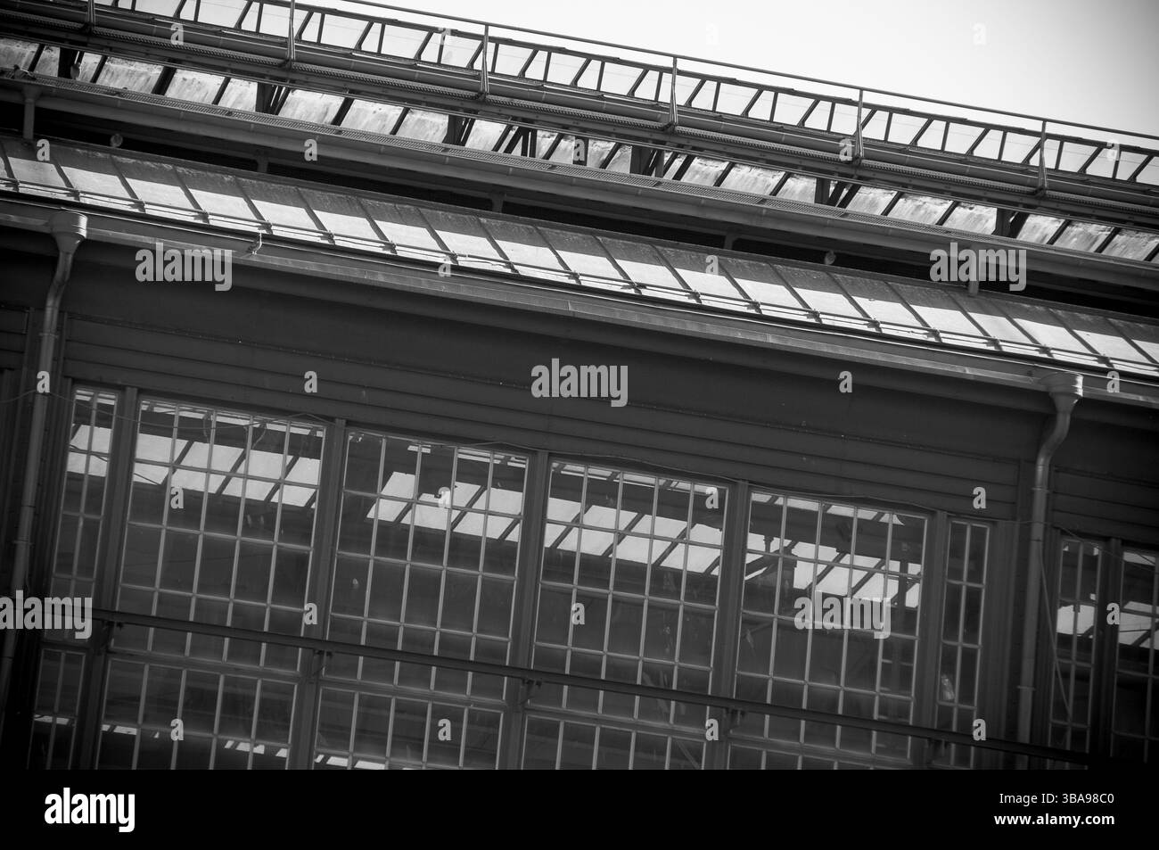 Sunlight streams through large glass panels atop a historical Berlin ...